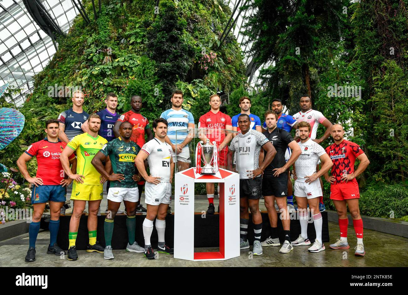The team captains from all nations competing pose with the trophy ...