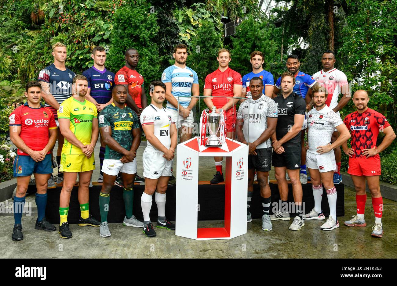 The team captains from all nations competing pose with the trophy ...