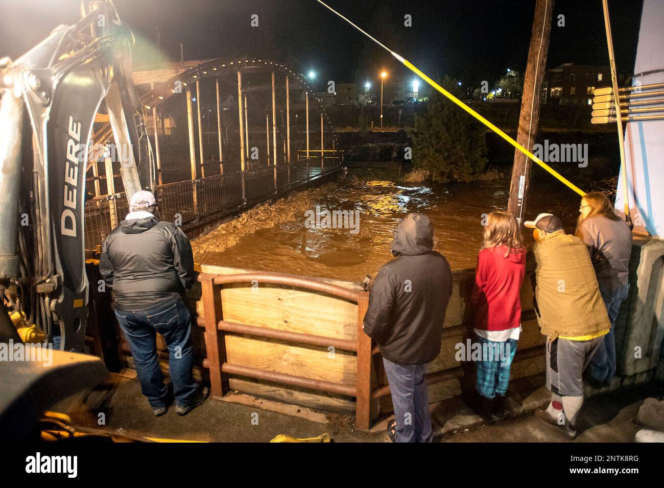 People look on as floodwaters from the South Fork of the Palouse River ...