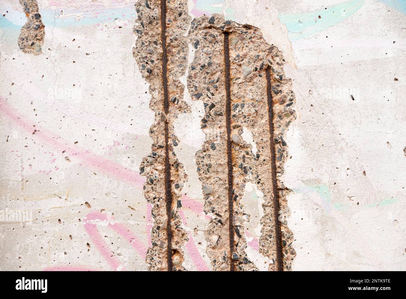 closeup fragment of famous Berlin wall ruins with open rusty carcass ...
