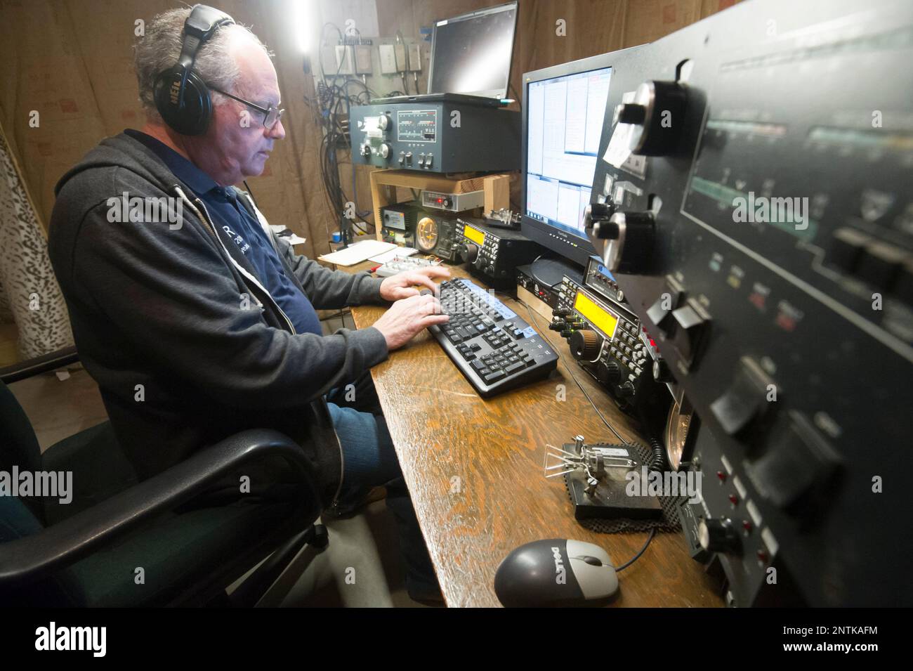 HAM radio veteran Mark Pride demonstrates the capabilities of his radio ...