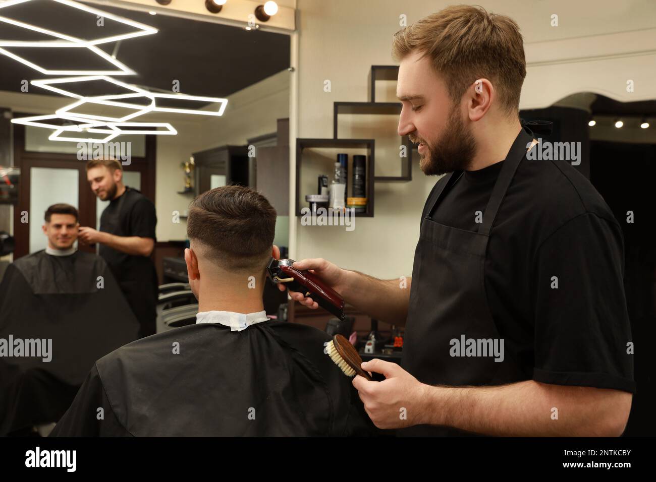 Professional hairdresser making stylish haircut in salon Stock Photo ...