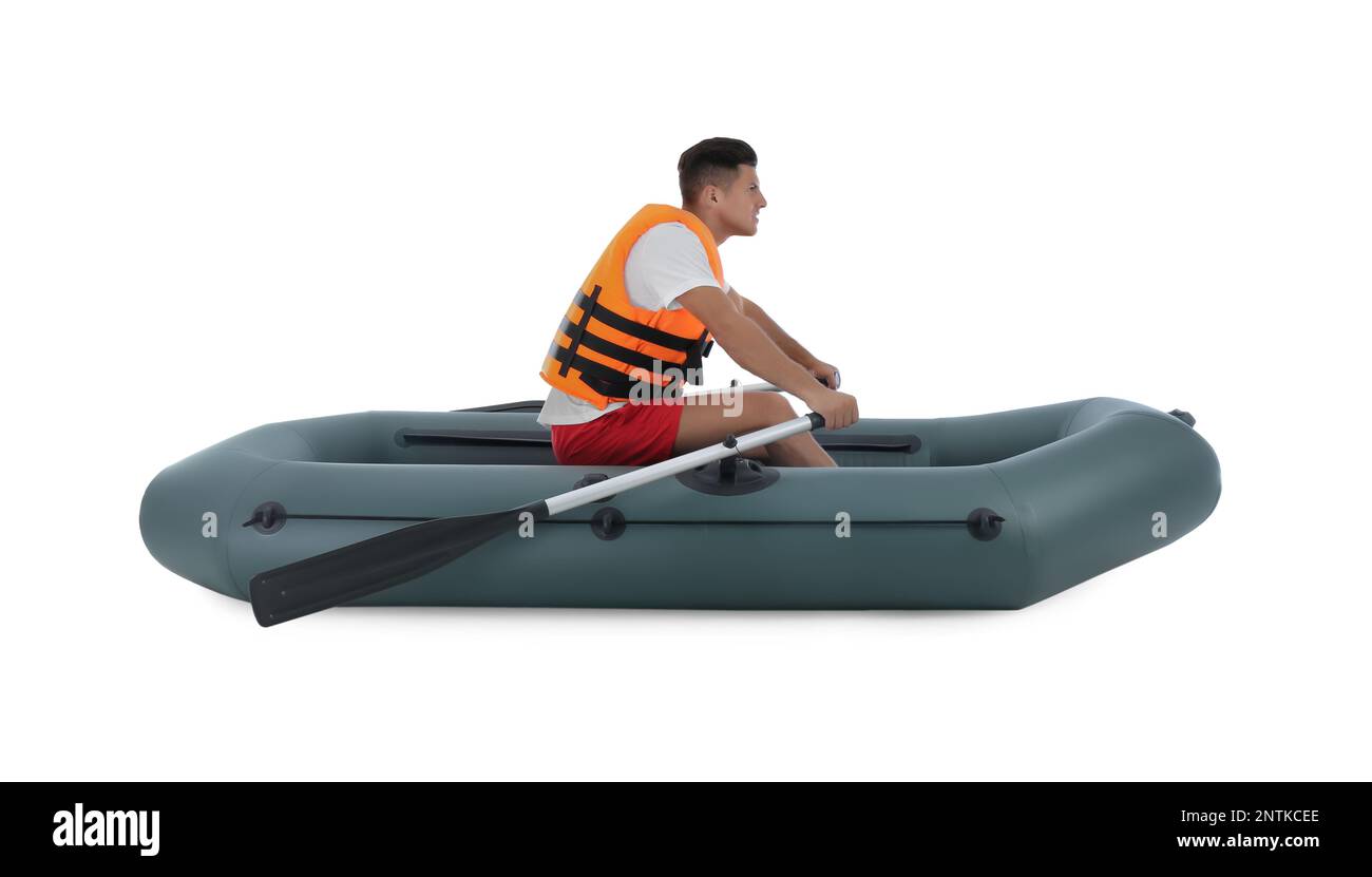 Man in life vest rowing inflatable rubber boat on white background ...
