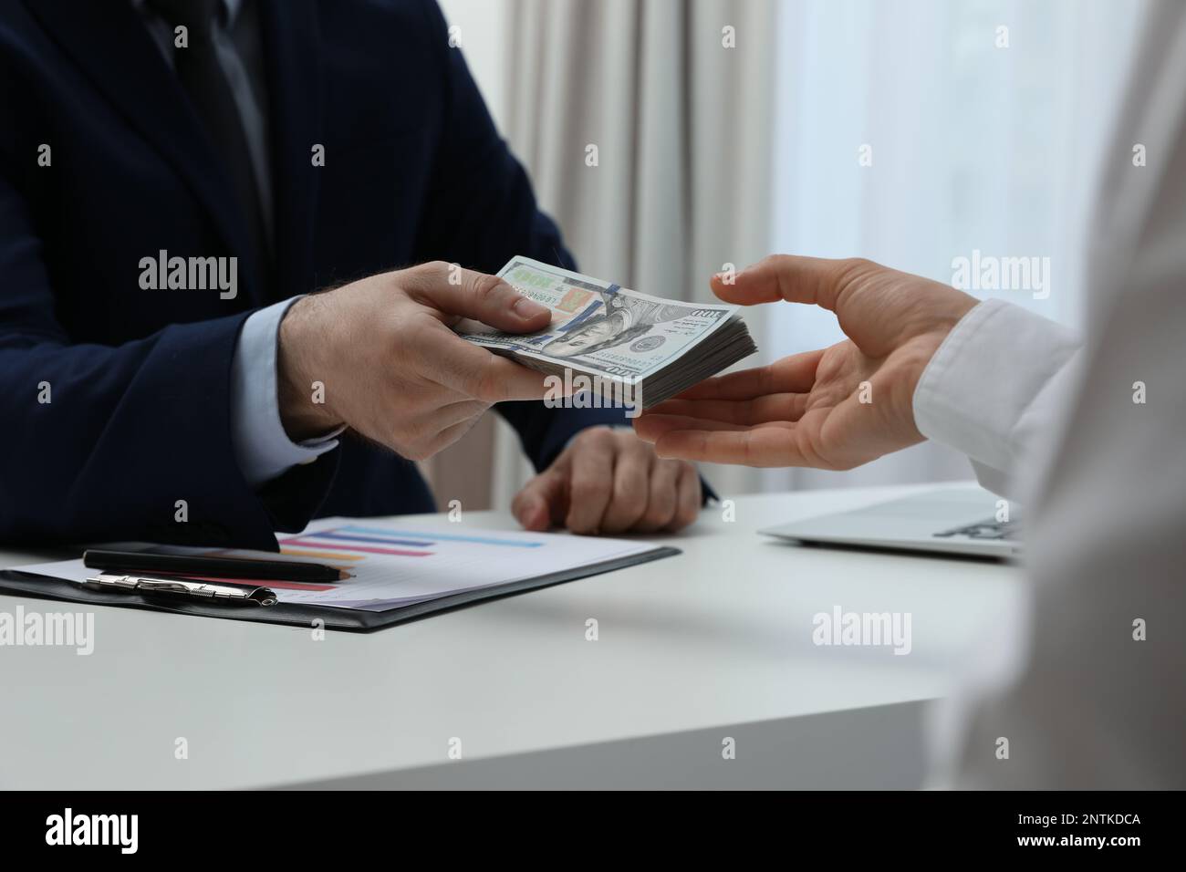 Cashier giving money to businesswoman at desk in bank, closeup Stock ...