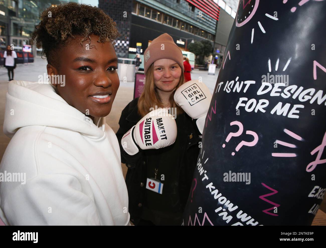 EDITORIAL USE ONLY Nicola Adams (left) coaches Hattie Scott to punch a ...