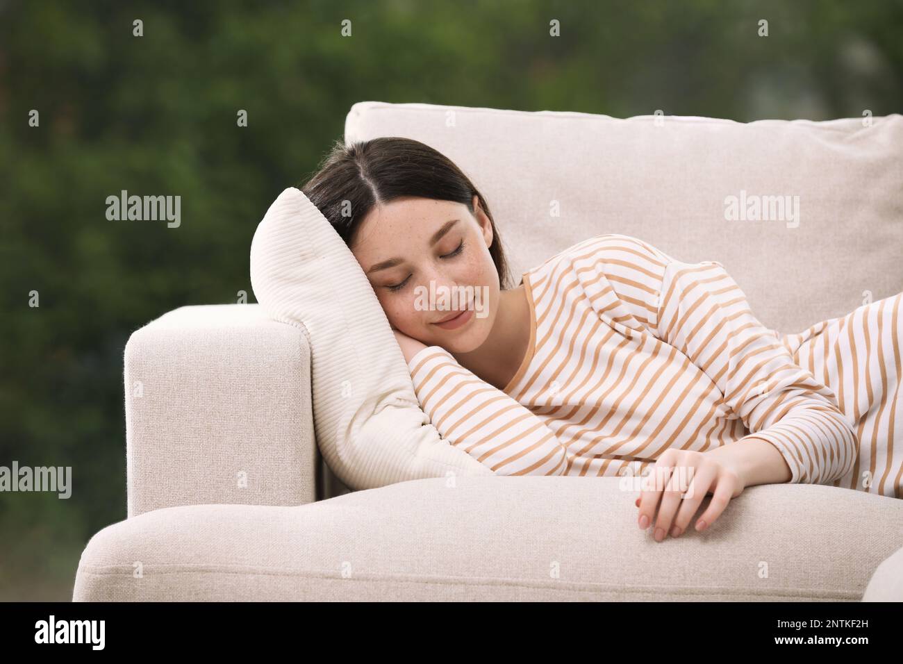 Teenage girl sleeping on sofa at home Stock Photo - Alamy