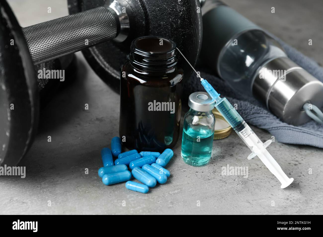 Different drugs and sports equipment on grey background. Doping control ...