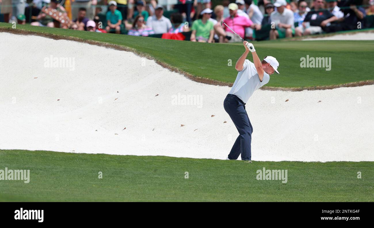 Keith Mitchell hits out of the bunker to the 18th green during a ...