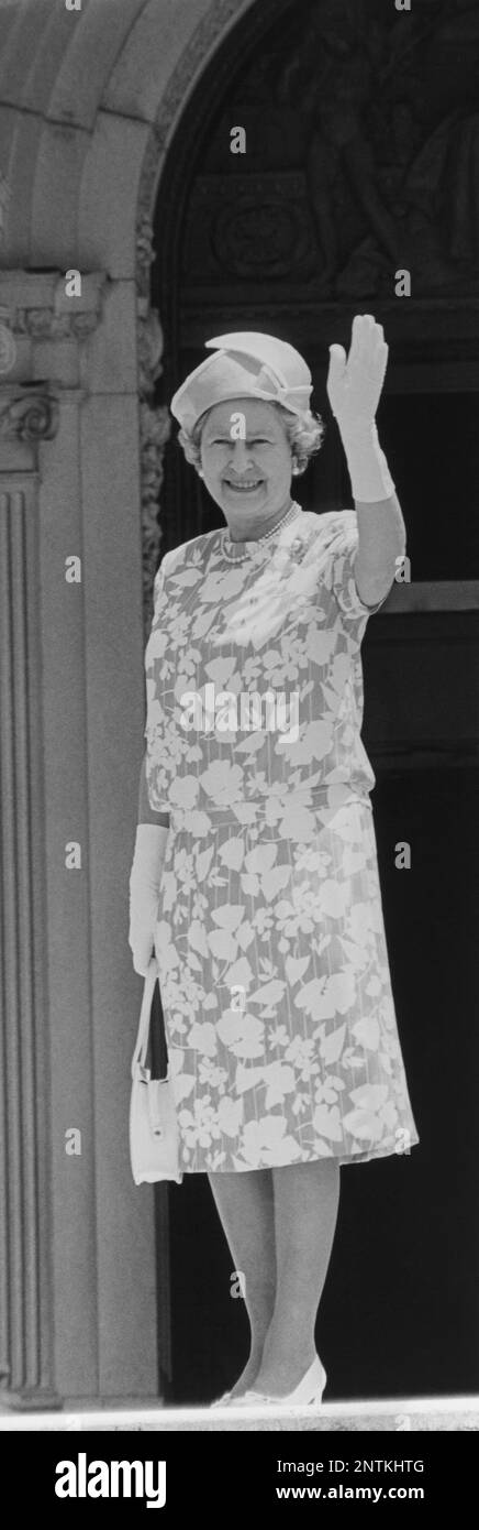 Queen Elizabeth II, waving many tourist lining the sidewalk clapping as ...