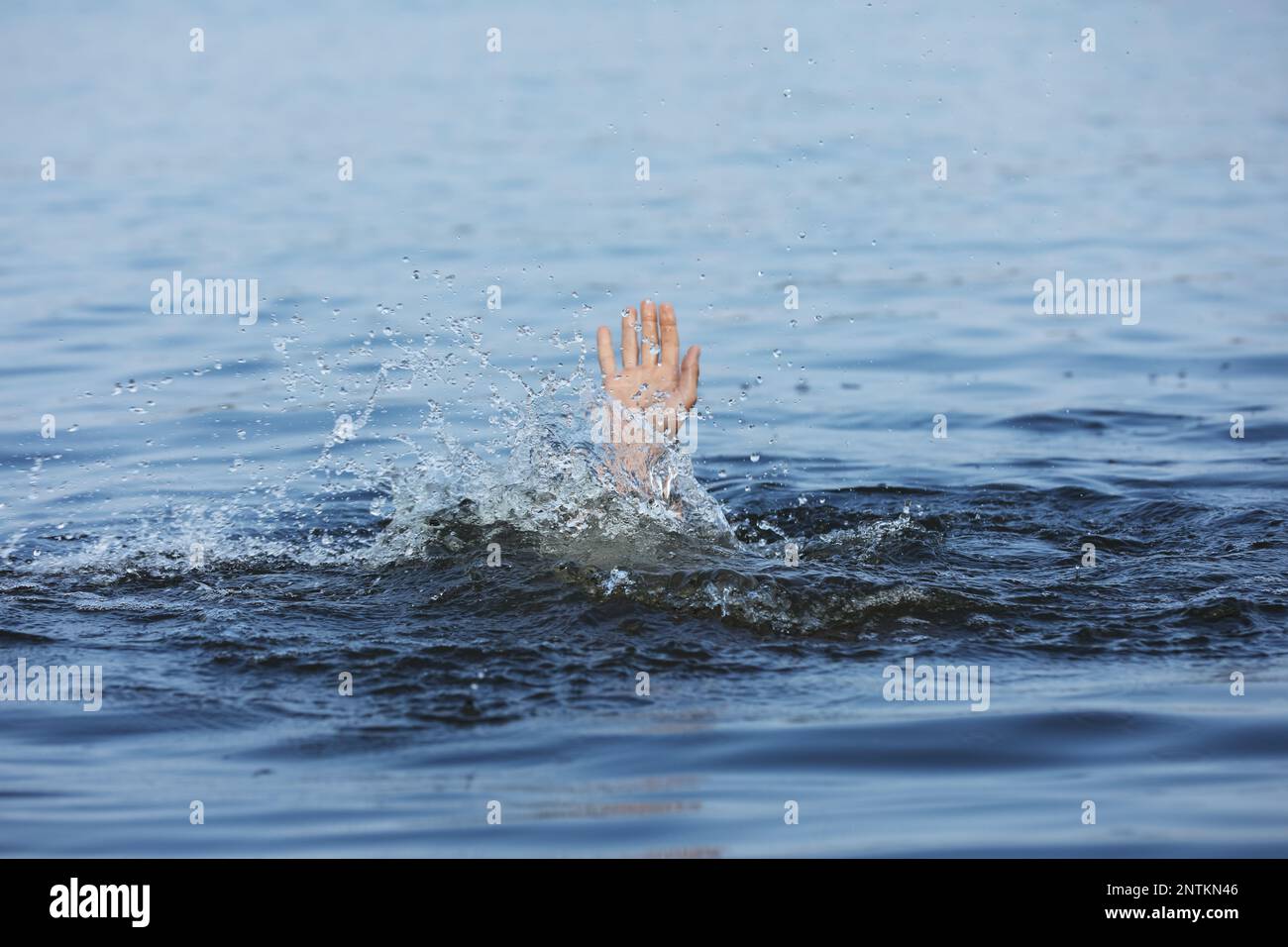 Drowning man reaching for help in sea, closeup Stock Photo - Alamy
