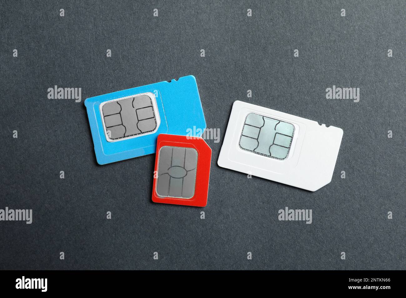 Different SIM cards on black table, flat lay Stock Photo - Alamy