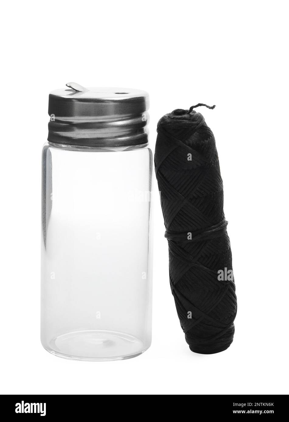 Roll of natural dental floss and jar on white background Stock Photo ...