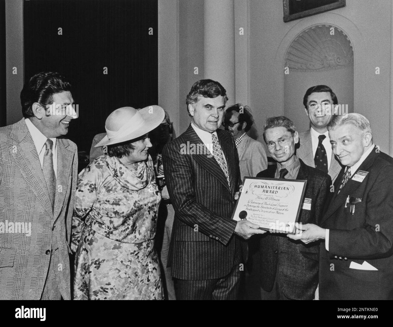 Chairman Rep. Al Ullman, D-Ore., giving certificate to party members ...