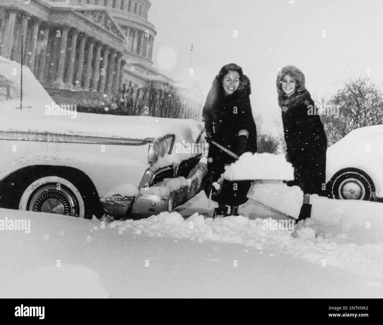 Rep. Charlotte Thompson Reid, R-Ill., removing snow from in front of ...