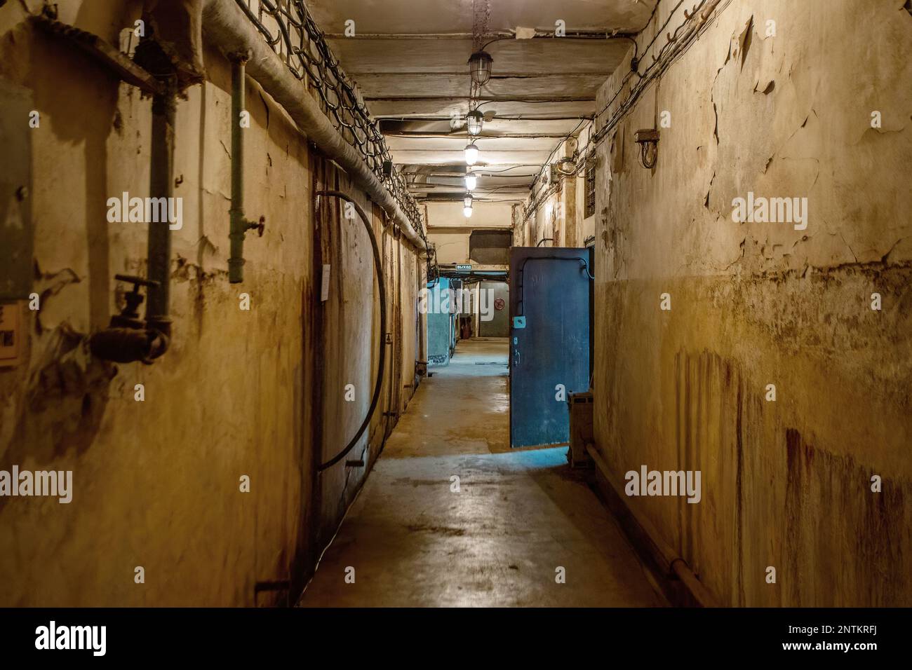 Abstract dark corridor of military bunker interior, grungy old ...