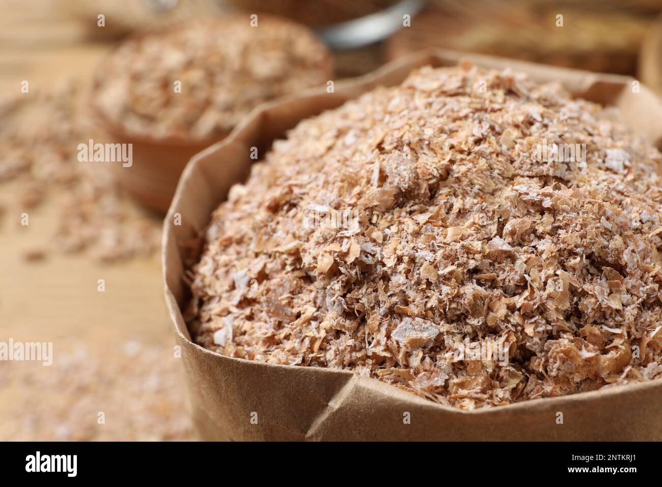 Paper bag with wheat bran, closeup view Stock Photo - Alamy