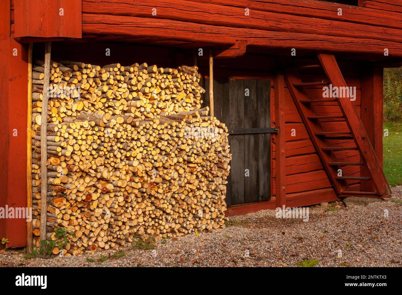 wood store outside a log house Stock Photo - Alamy