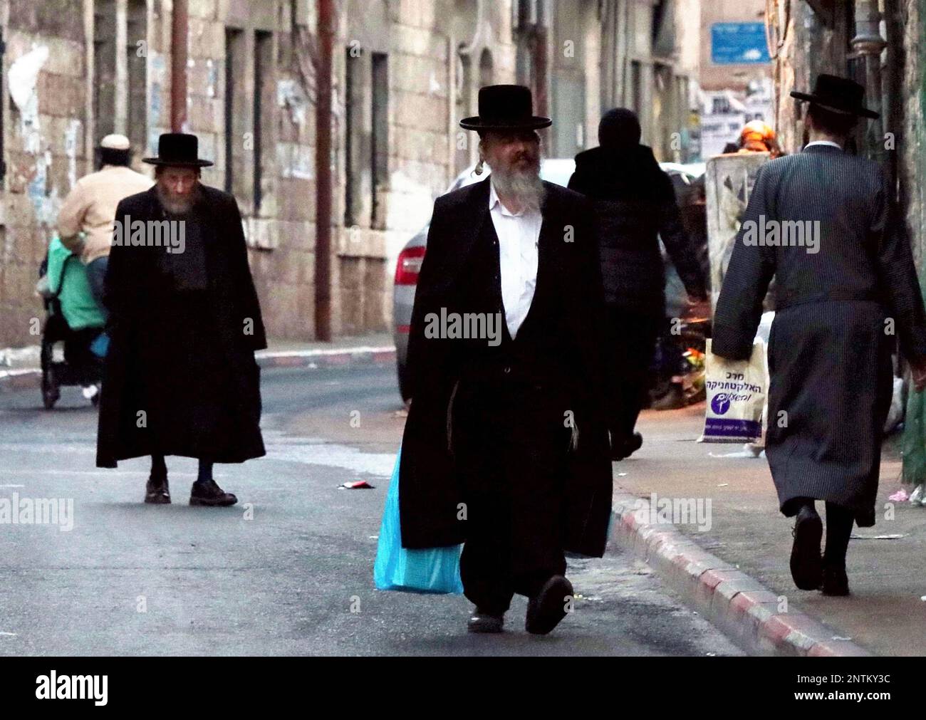 Haredi Judaism, ultra-Orthodox Judaism, men wearing a black suit and a ...