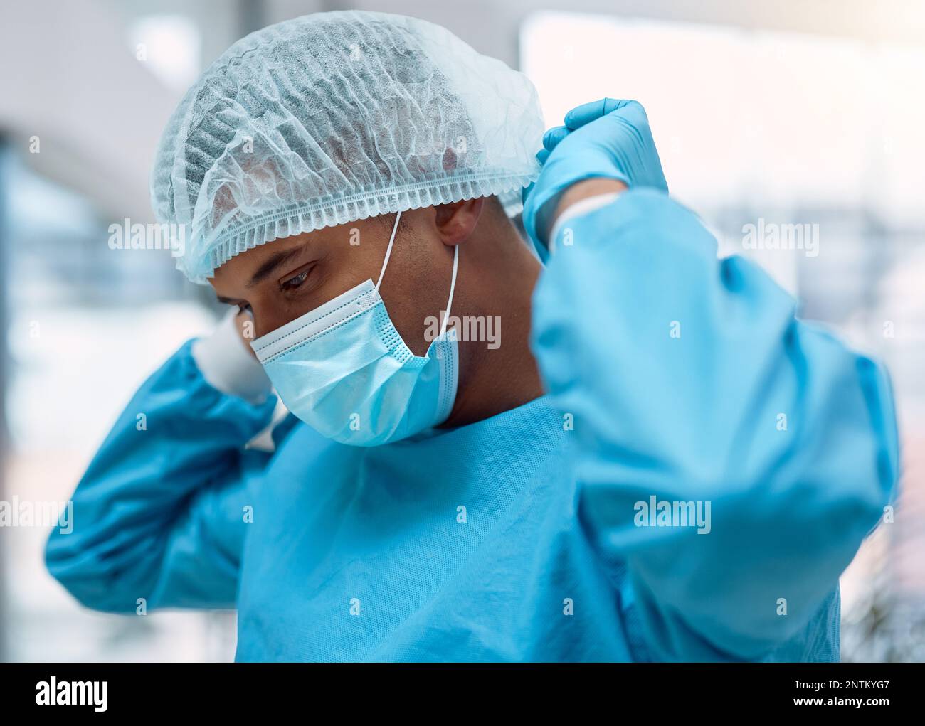 Surgeon, doctor and surgery with face mask and health, man in ppe for ...