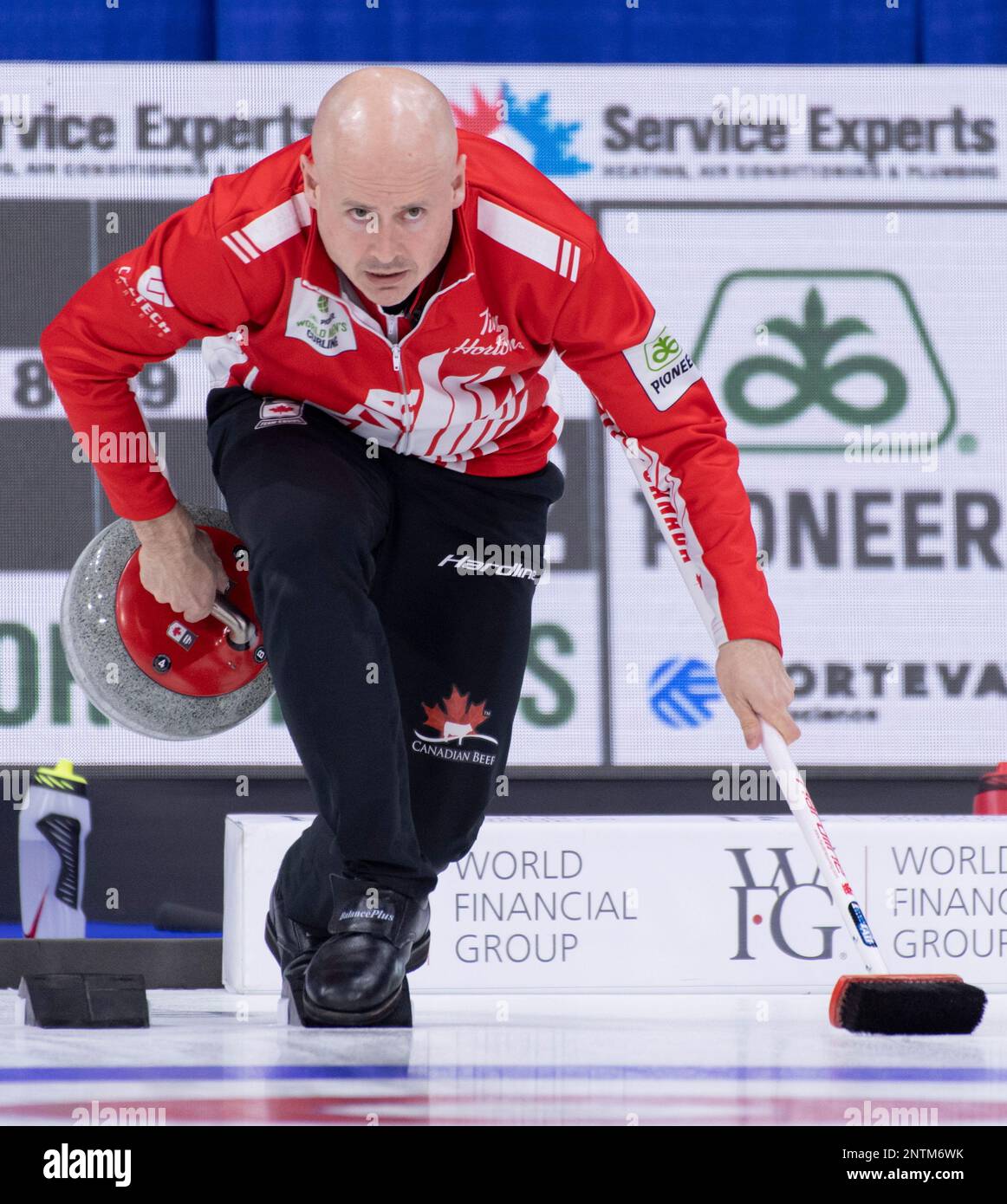 Canada skip Kevin Koe winds up for a shot during the team's match ...