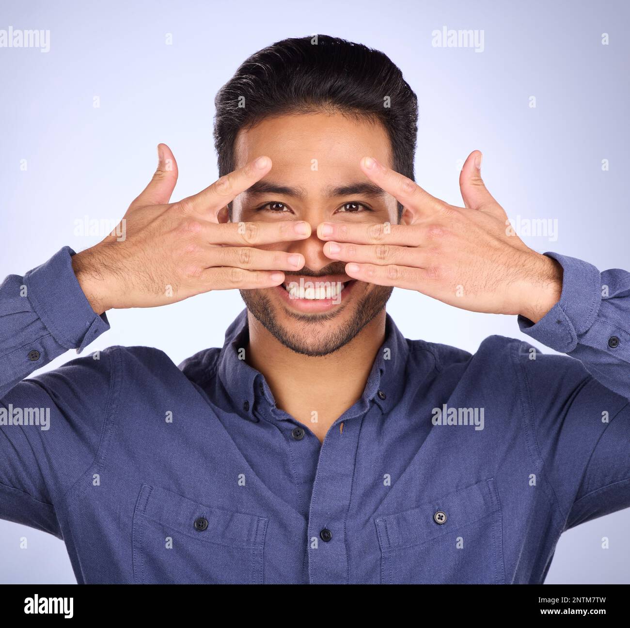 Hiding, funny and portrait of an Asian man with a hand isolated on a ...