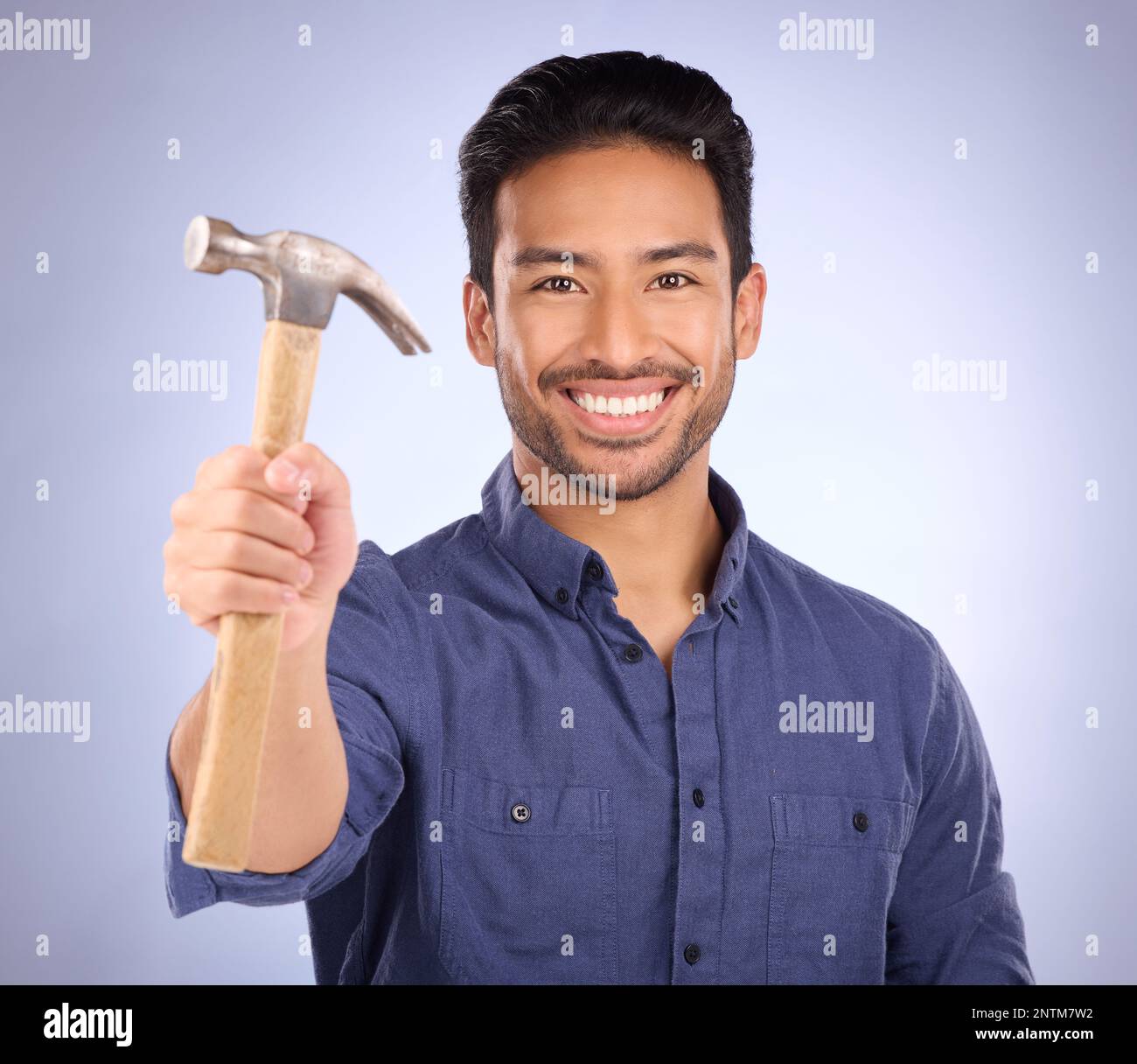 Construction, showing and portrait of an Asian man with a hammer ...
