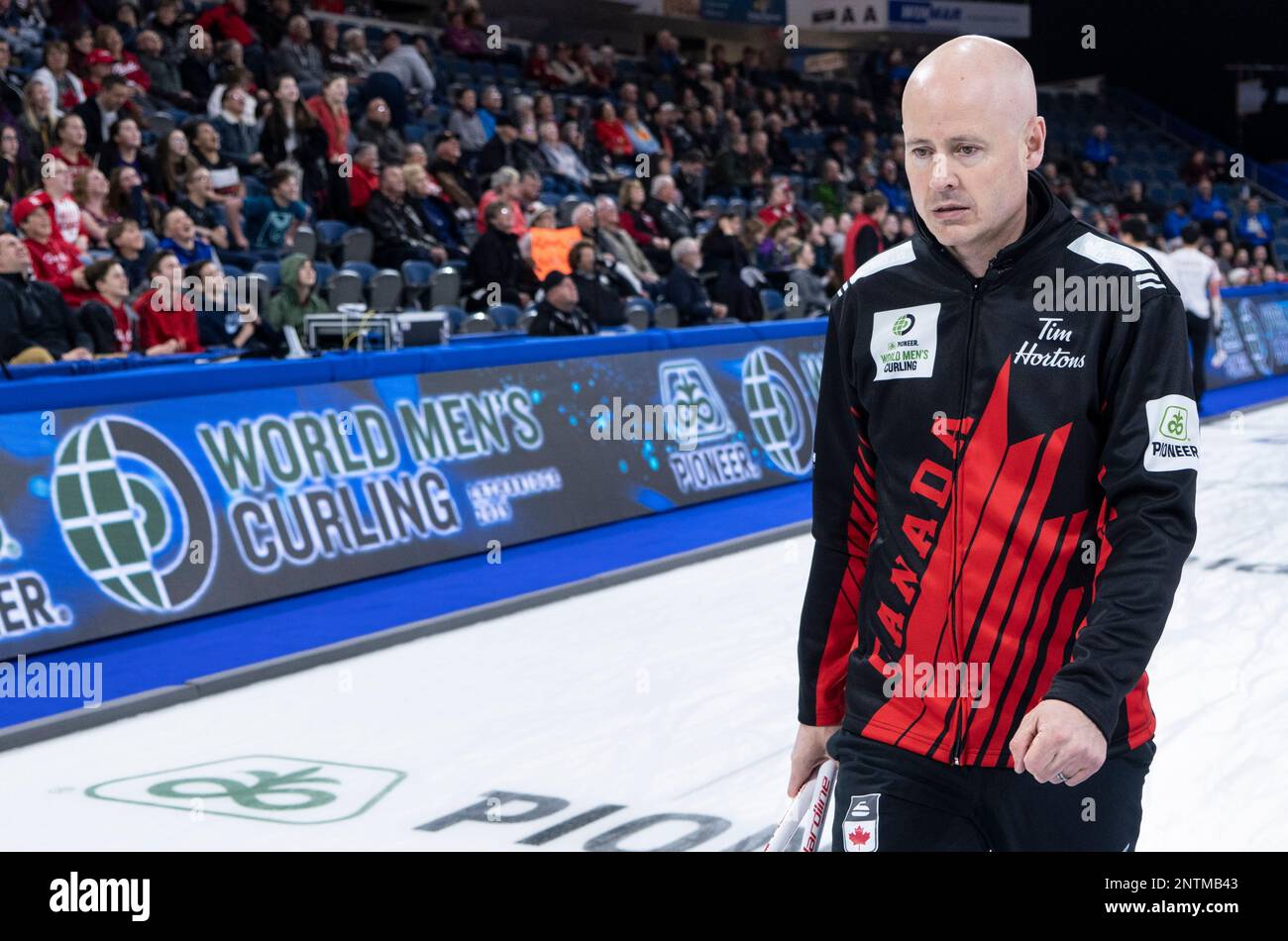 Canada skip Kevin Koe makes his way down the ice during their game ...