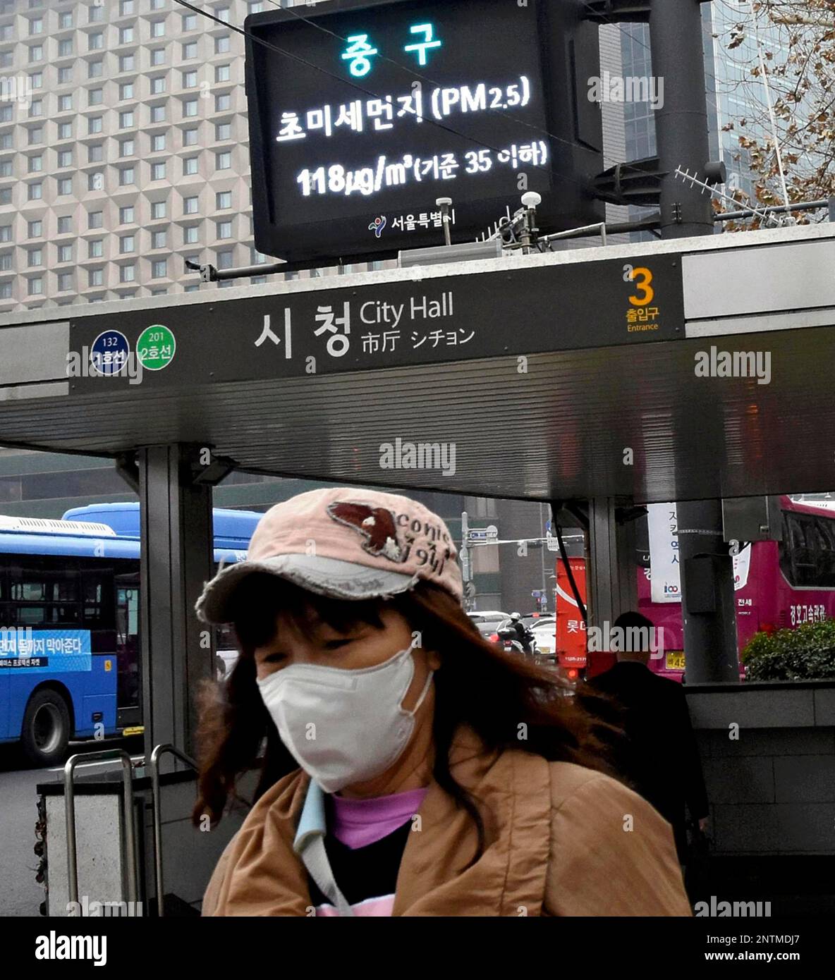 People wear masks as the PM 2.5 is measured the highest on record in ...