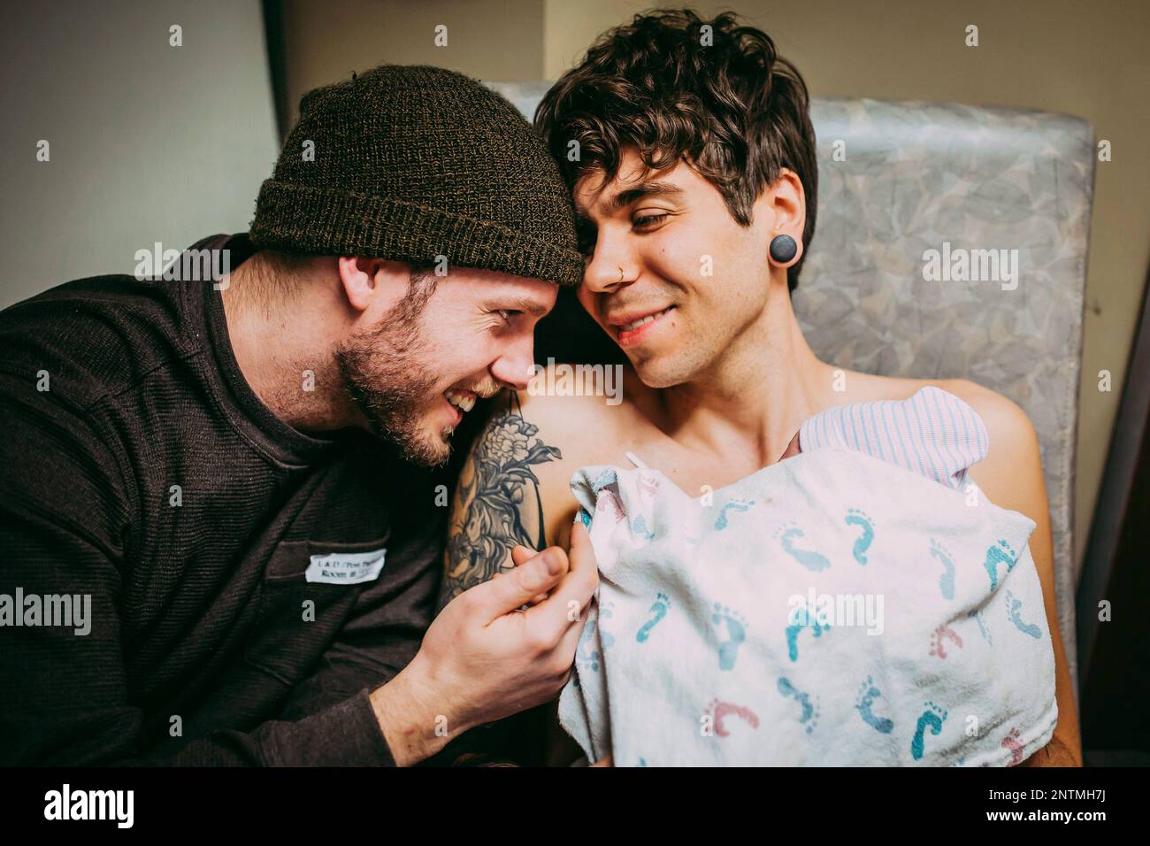 In this March 25, 2019 photo, Elliot Dougherty, right, holds his ...