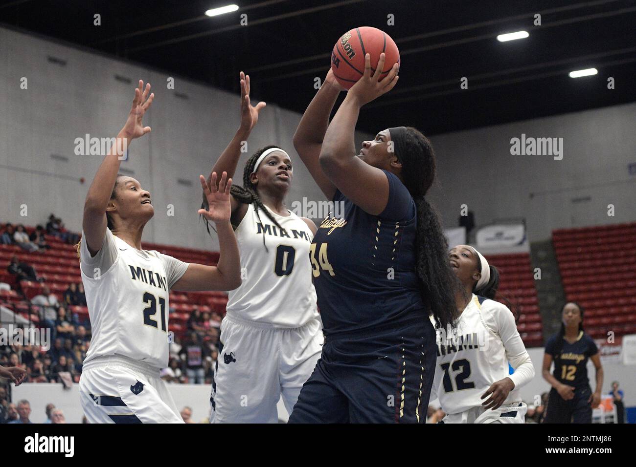 Wekiva's Jacqulyn Butler (34) goes up for a shot in front of Miami's ...