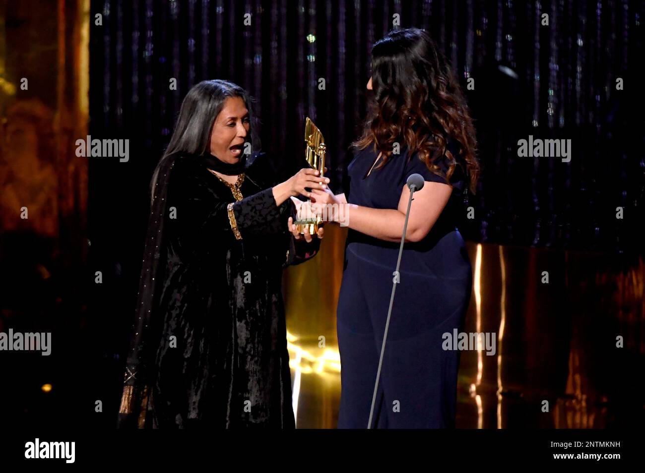 Deepa Mehta accepts her award from her daughter Devyani Saltzman at the Canadian Screen Awards ...