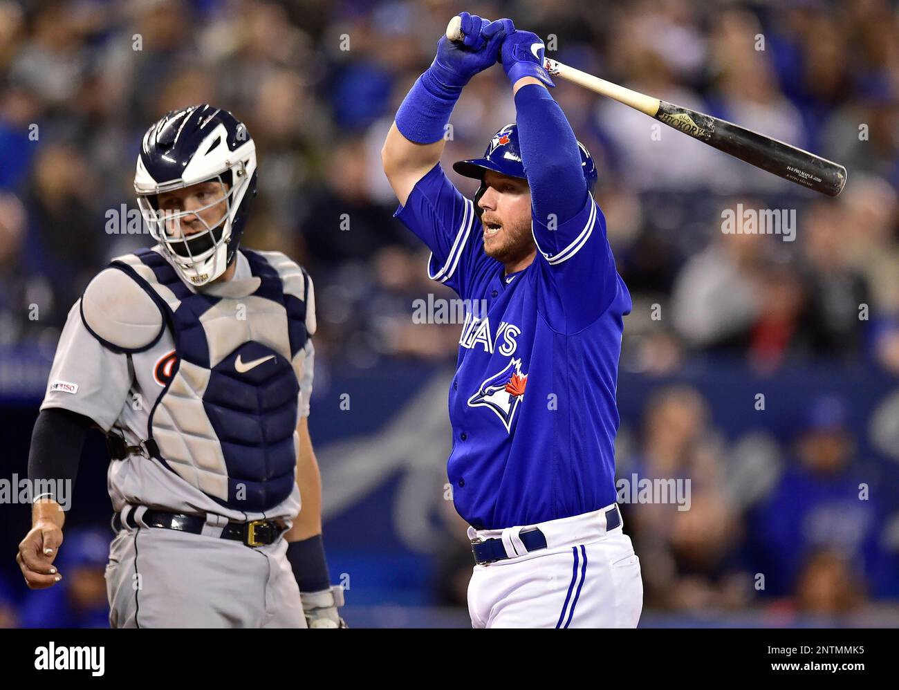 Toronto Blue Jays first baseman Justin Smoak, right, reacts after being ...