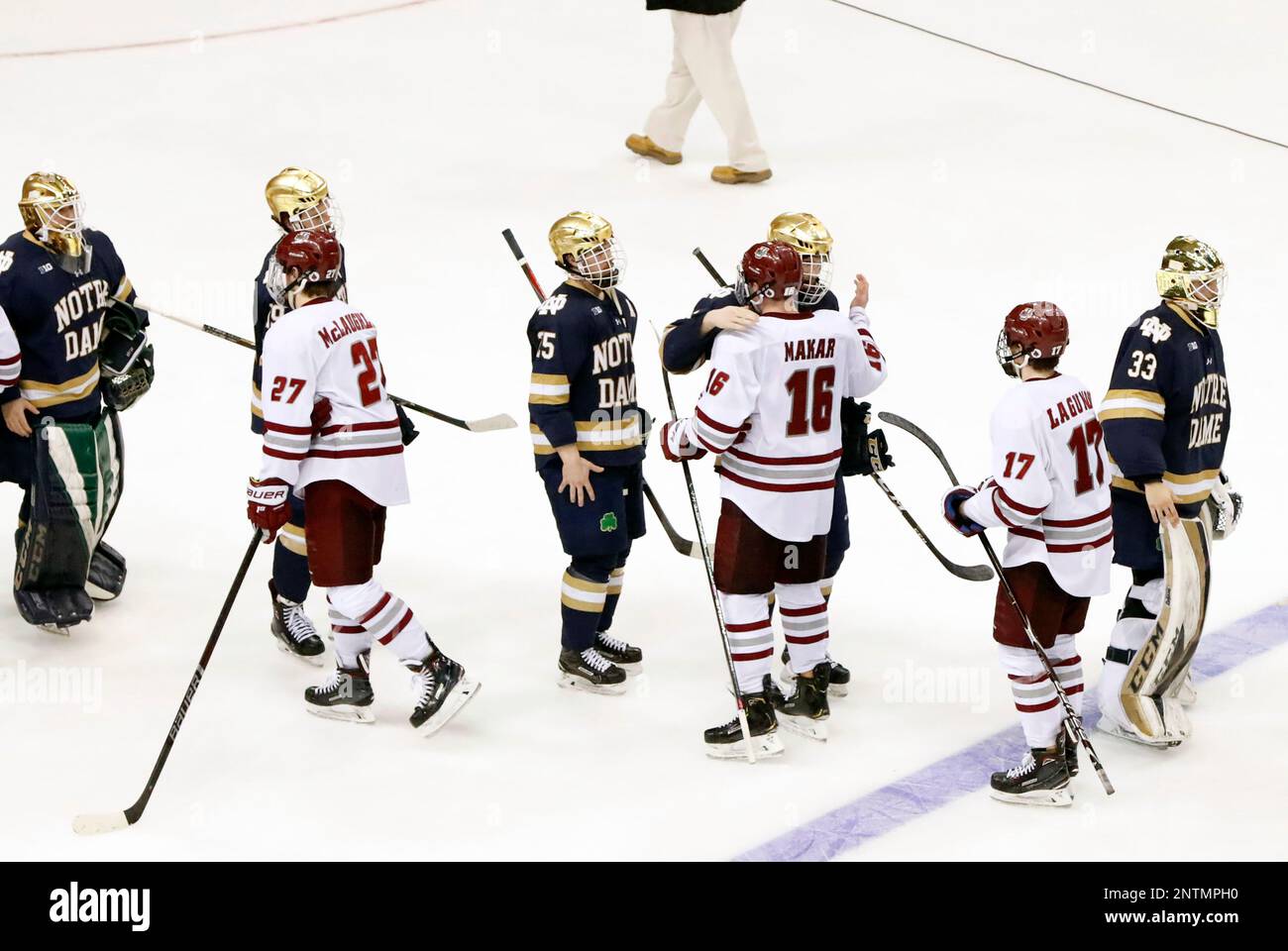 MANCHESTER, NH - MARCH 30: Notre Dame and UMASS shake hands after the ...