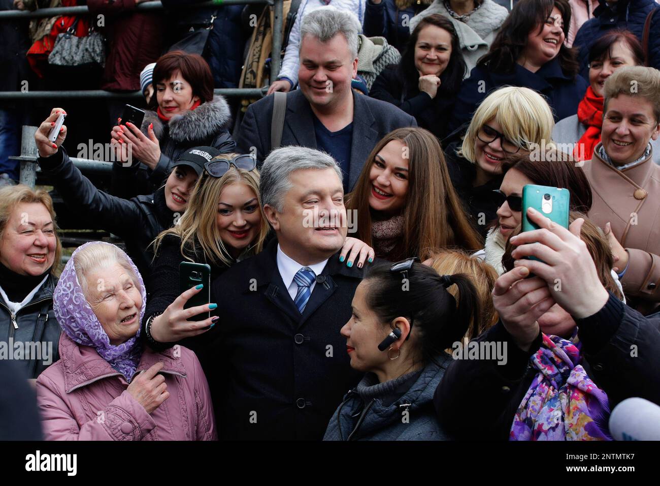 Ukrainian President Petro Poroshenko, center, smiles as he poses for ...