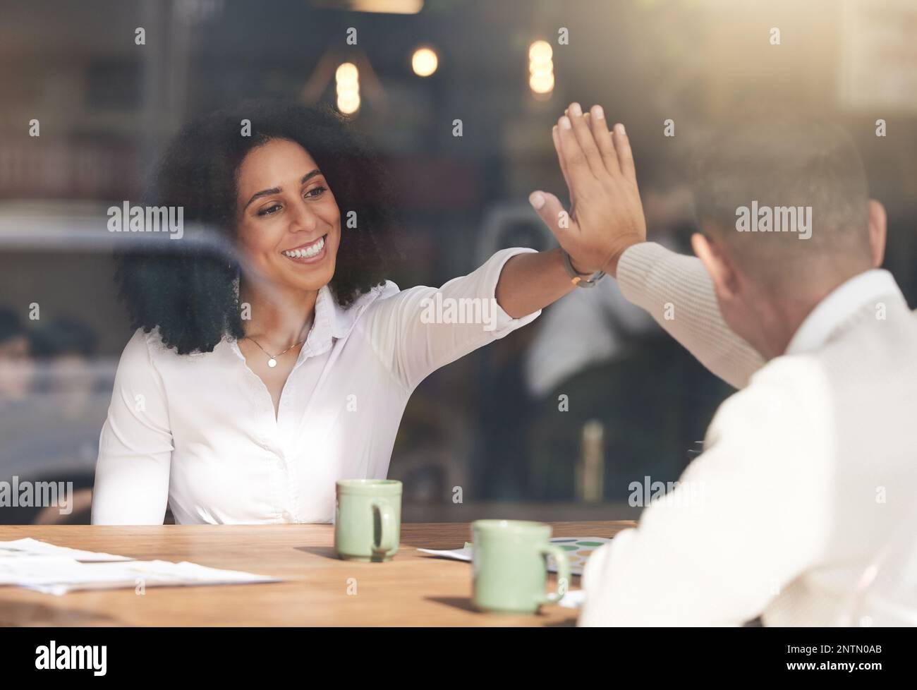 Business people, high five and celebration in meeting for planning ...