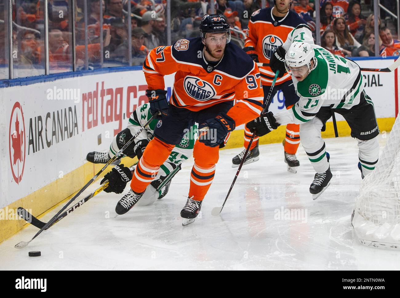 Dallas Stars' Mattias Janmark (13) chases Edmonton Oilers' Connor ...