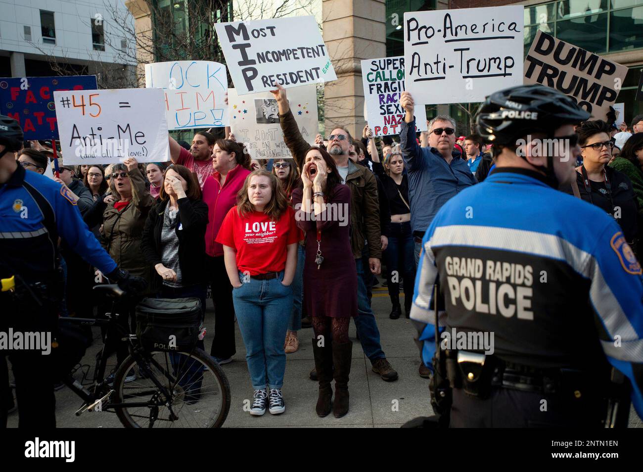 Protesters boo outside of Van Andel Arena as President Donald Trump is ...