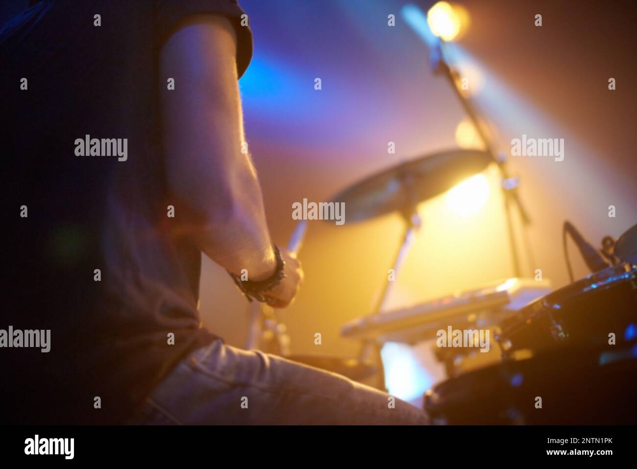 Smacking the skins hard. A young drummer rocking out on stage Stock ...