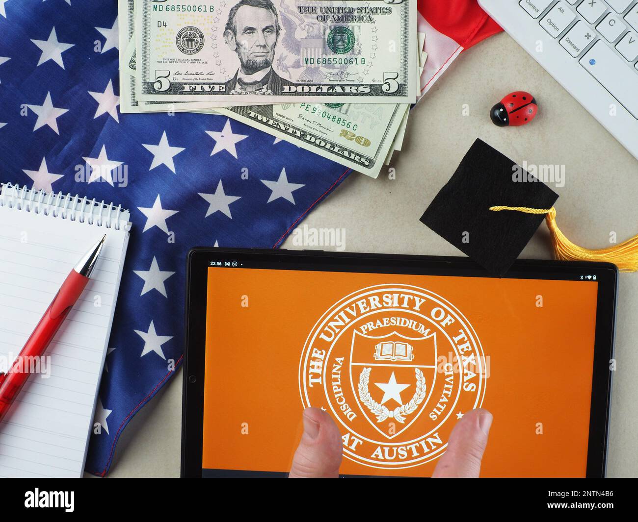 IIn this photo illustration, University of Texas at Austin logo seen ...