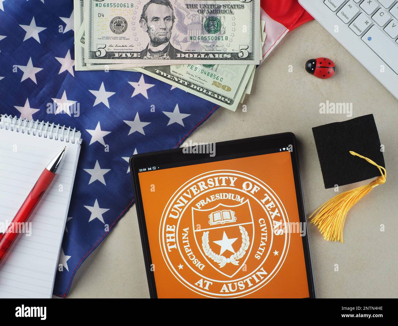 IIn this photo illustration, University of Texas at Austin logo seen ...