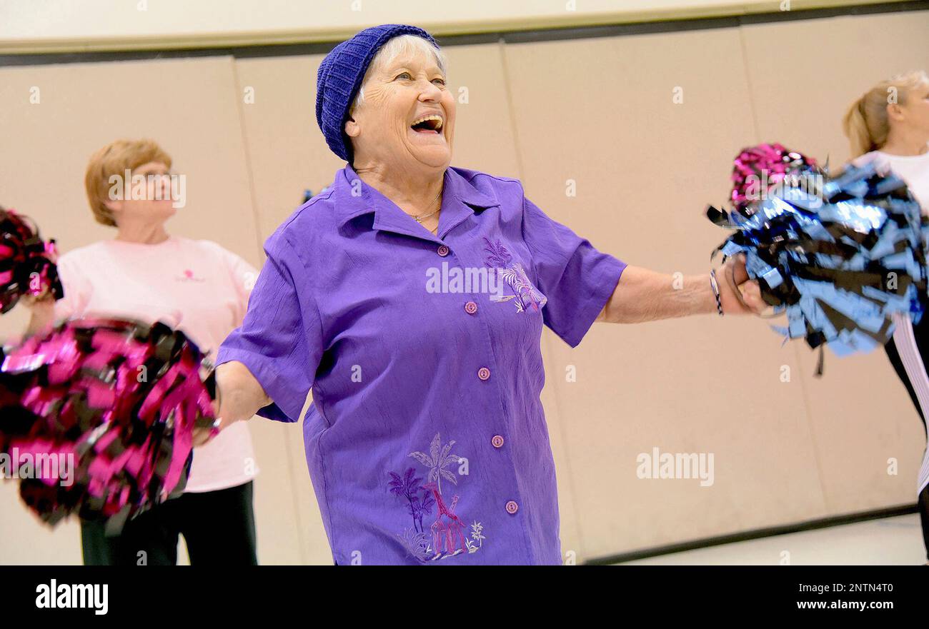 Sally Hord, 77, of Archdale, smiles as she cheers during a High Point ...