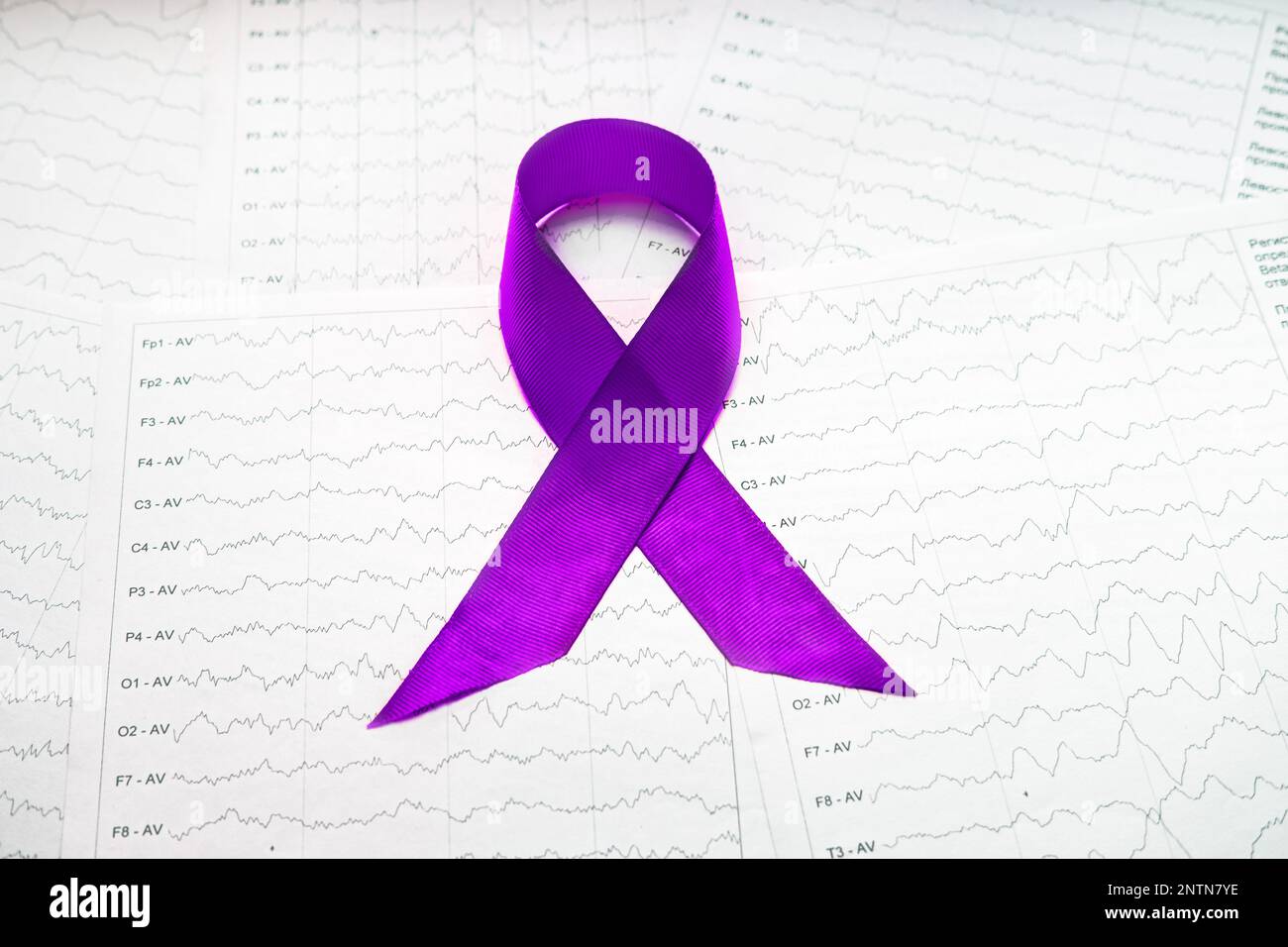 International Epilepsy Day, Epilepsy awareness. Purple ribbon on brain ...