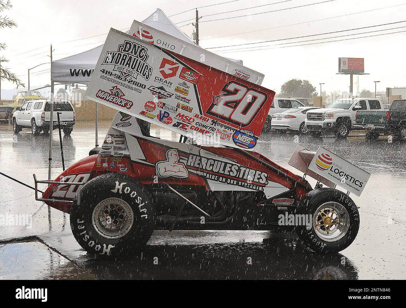 Rain pours on the Greg Wilson Racing sprint car on display Tuesday ...