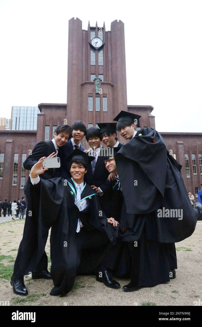 Graduate students of Tokyoi University pose for a photograph in front ...
