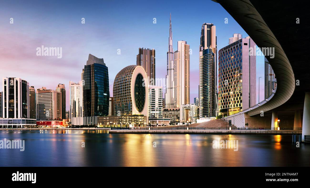 Panoramic view of Dubai Creek and night city skyline, United Arab ...