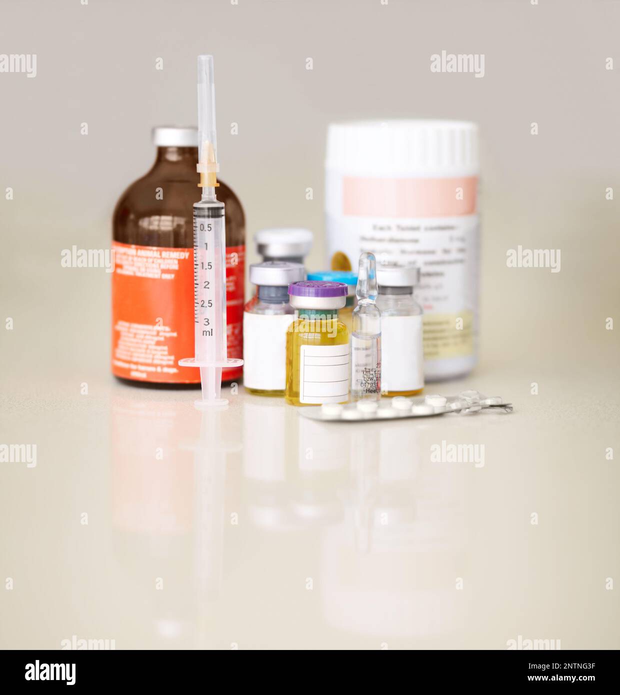 A mass of medicine. Bottles of medicine and pills with a syringe and ...