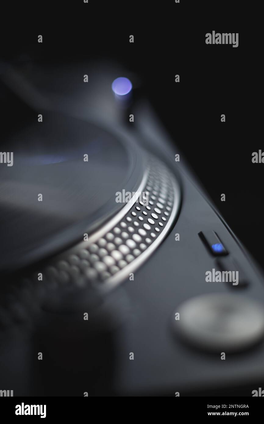 Vinyl record on dj turntable. Retro style disc jockey player for ...