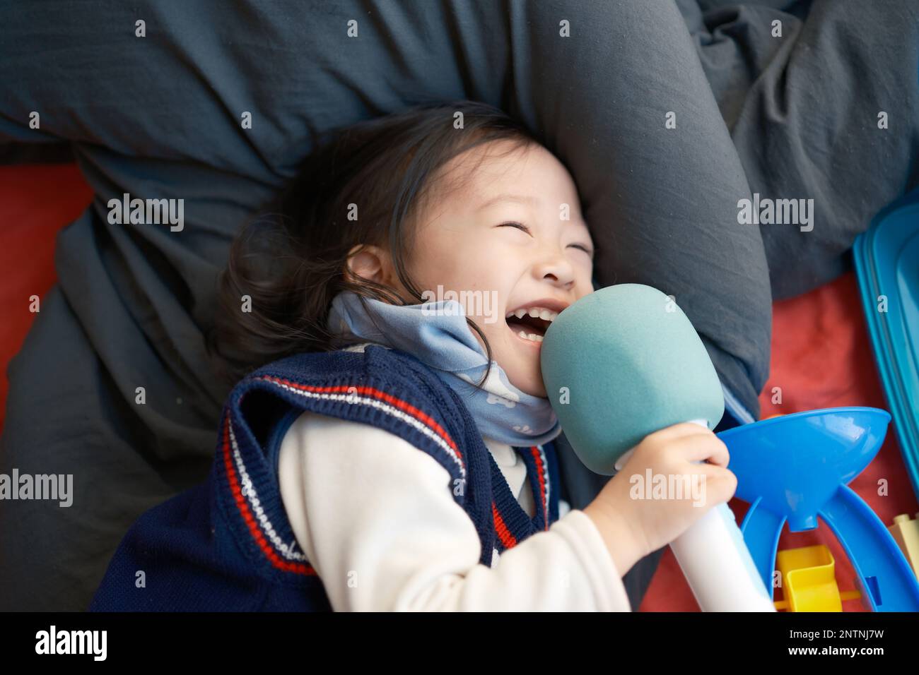 Lovely baby singing Karaoke Stock Photo - Alamy