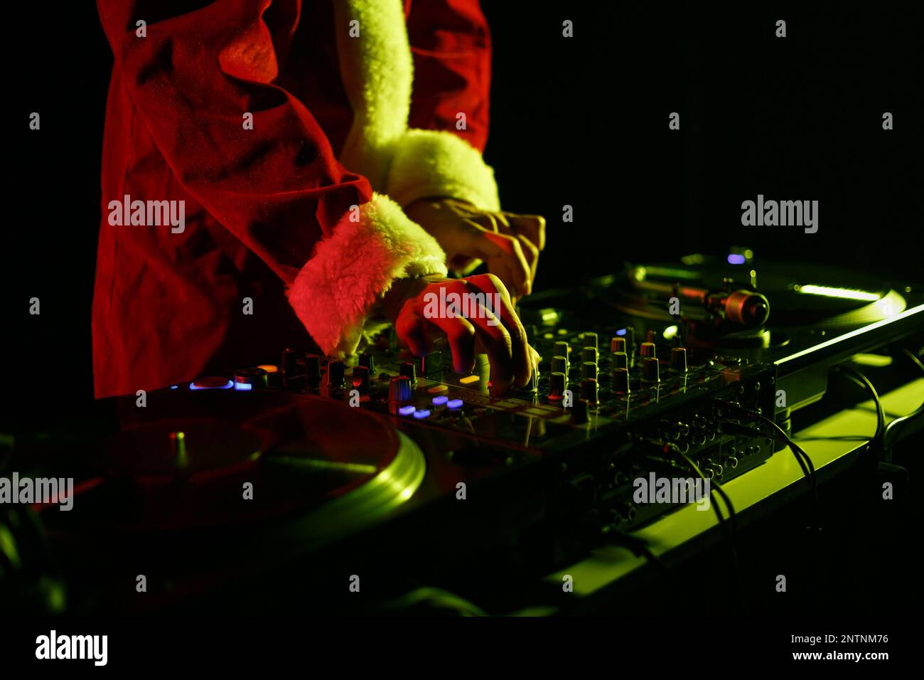Santa Claus DJ mixing music set on New Year's Eve celebration in night ...