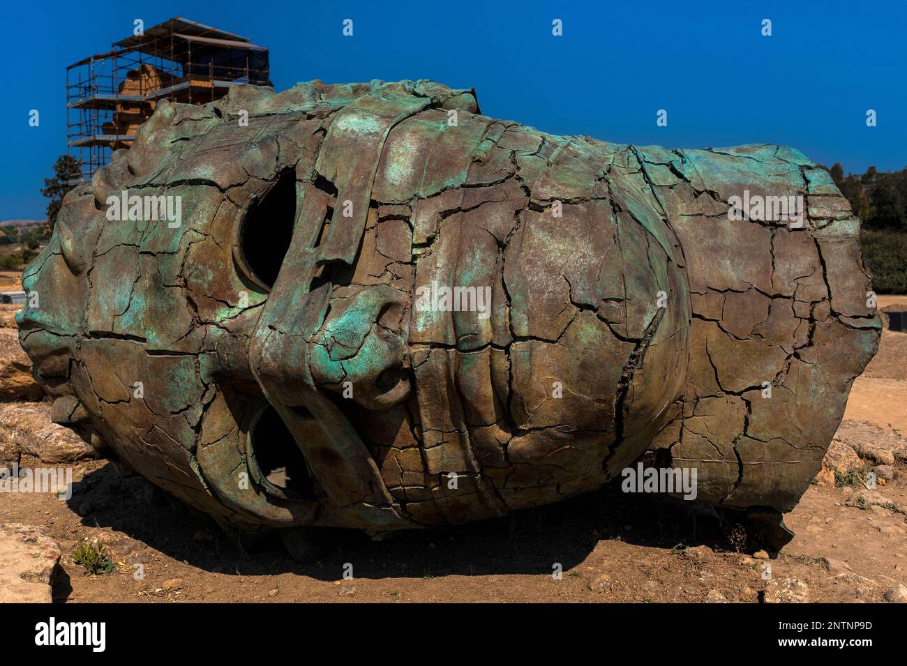 Vast bronze head of Eros, cracked and with empty eye sockets, by Polish ...